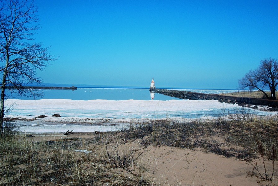 Superior, WI : Wisconsin Point Lighthouse with ice melting in the ...