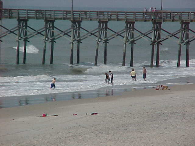 Surf City, NC : Enjoying the beach in Surf City photo, picture, image ...